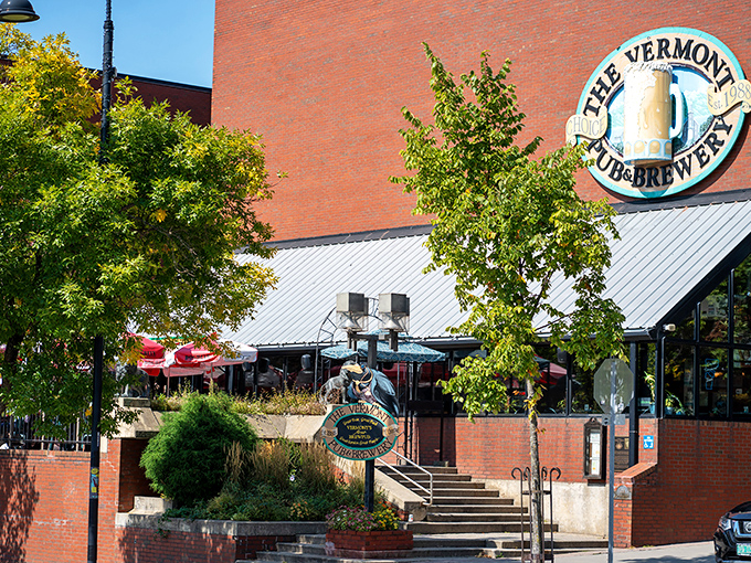 The brick facade of Vermont Pub & Brewery welcomes visitors with its iconic sign, promising craft beer adventures in downtown Burlington.