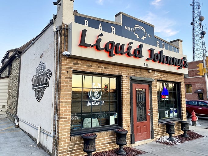 Welcome to Liquid Johnny's, where the neon sign beckons like a lighthouse for hungry souls. This unassuming brick facade hides a world of culinary delights.