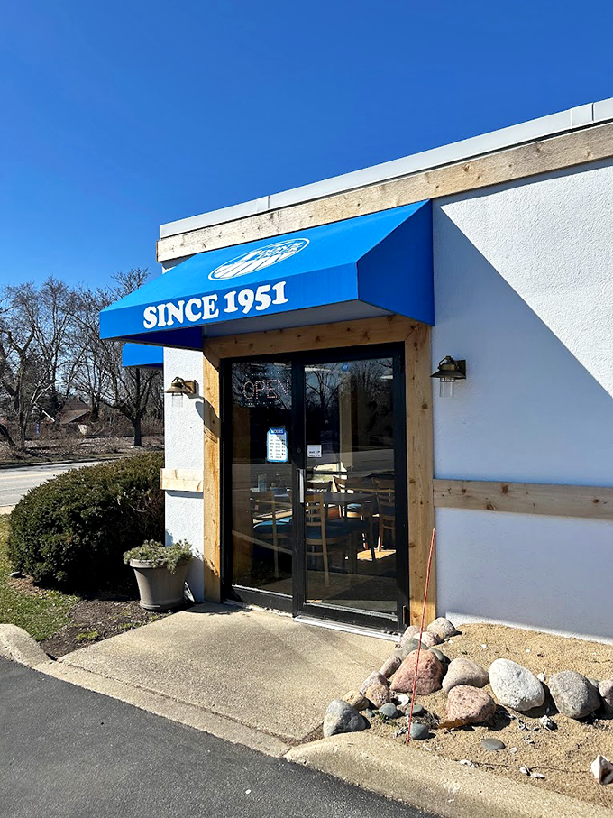 Welcome to seafood paradise! Don's Dock's bright blue awning beckons like a lighthouse, guiding hungry sailors to a harbor of deliciousness. 