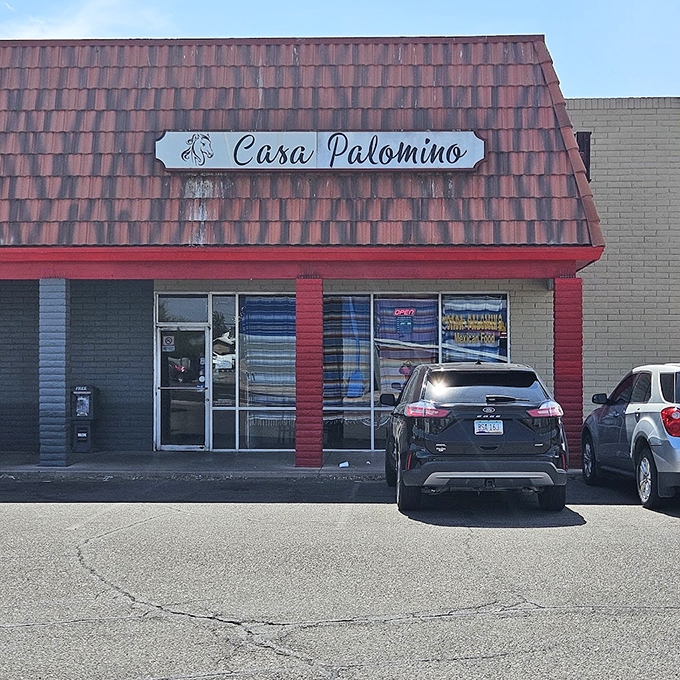 Welcome to Casa Palomino, where the red trim says "fiesta" and the palm trees whisper "siesta." This unassuming facade hides a world of flavor waiting to be discovered.