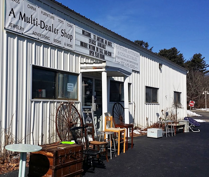 The unassuming white exterior houses a wonderland of vintage finds, with outdoor displays hinting at the treasures within.
