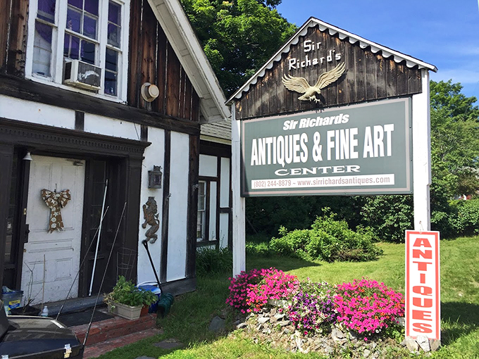 A charming Vermont storefront where vibrant pink flowers greet treasure hunters, complete with a majestic eagle watching over vintage dreams.
