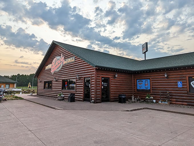 That log cabin exterior isn't just for show, it's your first hint that something special awaits inside this Sturgeon Lake treasure.