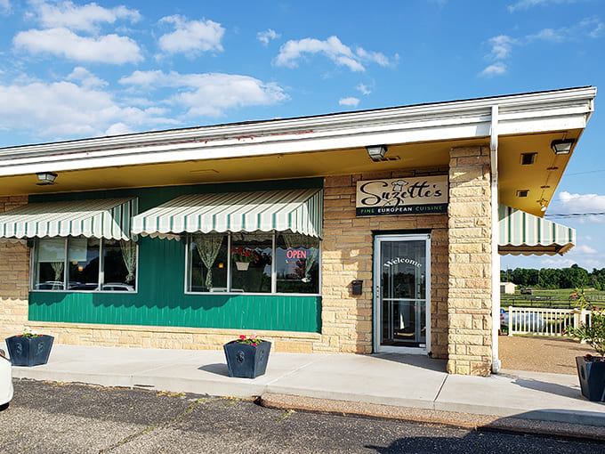 That green and white striped awning beckons like a European bistro somehow landed in Minnesota's countryside, promising culinary adventures within.