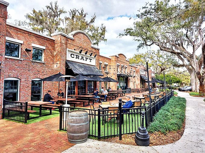 Rustic brick facades and inviting outdoor seating create the perfect backdrop for Plant Street Market's crown jewel: Crooked Can Brewing Company.