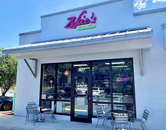 The unassuming white exterior with that signature pink sign promises dessert magic within &ndash; like finding the entrance to Narnia, but sweeter.