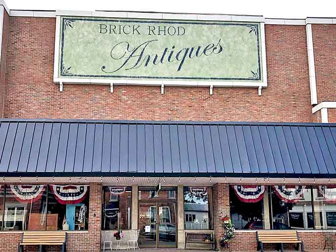 The brick fa&ccedil;ade of Brick Rhod Antiques welcomes visitors with patriotic bunting and a promise of treasures within &ndash; both edible and collectible.