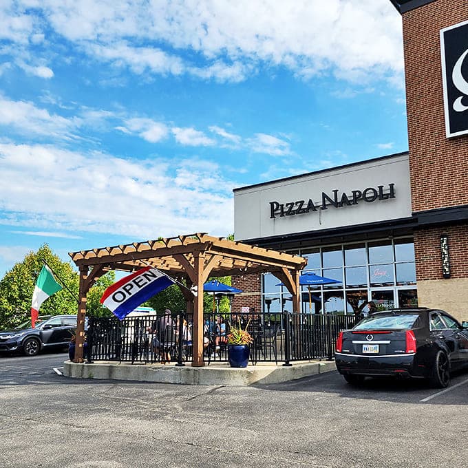 Where Ohio meets Italy! Pizza Napoli's inviting pergola and fluttering Italian flag promise authentic flavors hiding in plain sight.