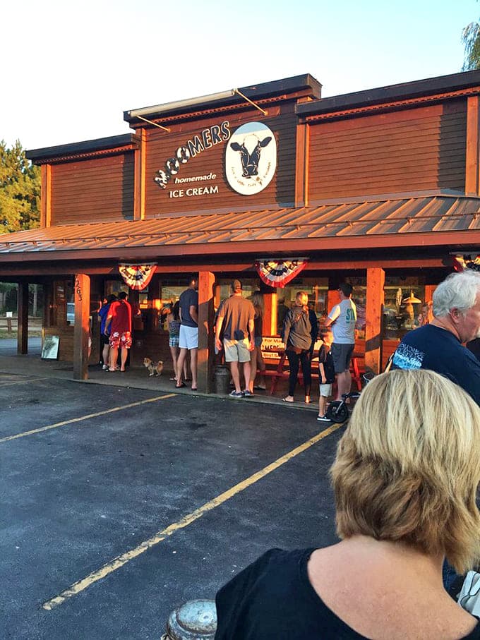 Exterior: The rustic wooden facade of Moomers beckons ice cream pilgrims like a dairy-filled oasis, complete with its iconic cow logo watching over patient devotees.