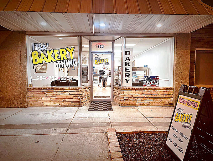 The unassuming storefront of Itsa Bakery Thing beckons with its cheerful yellow signage, promising sweet treasures within this Owosso gem.