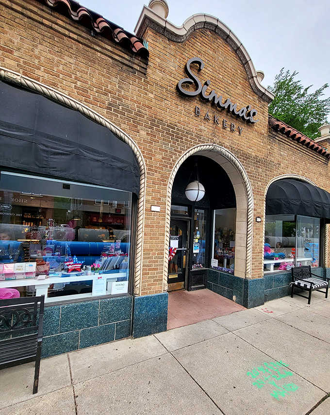 Simma's Bakery's distinctive Spanish-style brick fa&ccedil;ade stands as a beacon for dessert lovers, promising sweet treasures within.