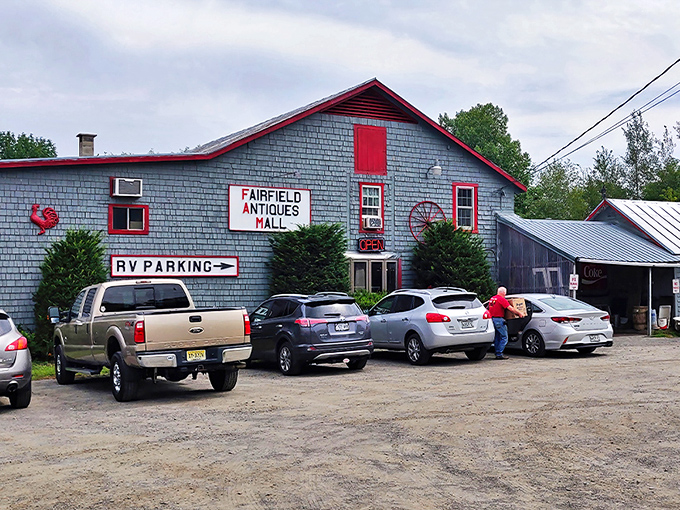 The weathered exterior with bright red trim stands like a beacon for treasure hunters &ndash; Maine's antiquing mothership has landed!