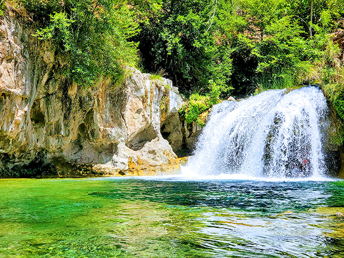 Nature's perfect plunge: Fossil Creek's 25-foot waterfall crashes into a pool so turquoise you'd swear you were in the Caribbean, not Arizona.