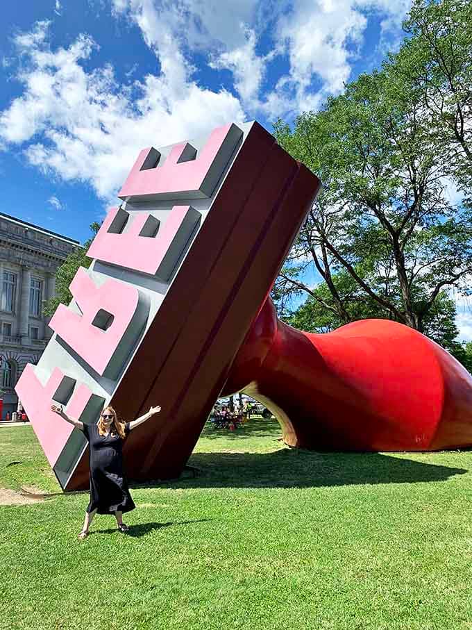The iconic Free Stamp lounges in Willard Park like an office supply that escaped the corporate world for a life of leisure and contemplation.