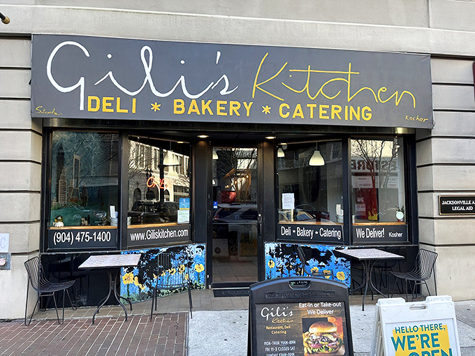 The inviting storefront beckons with its elegant blue and gold signage, promising Middle Eastern delights within this Jacksonville culinary gem.