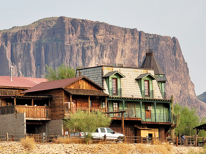 The iconic wooden structures of Goldfield Ghost Town stand proudly against the dramatic backdrop of the Superstition Mountains.