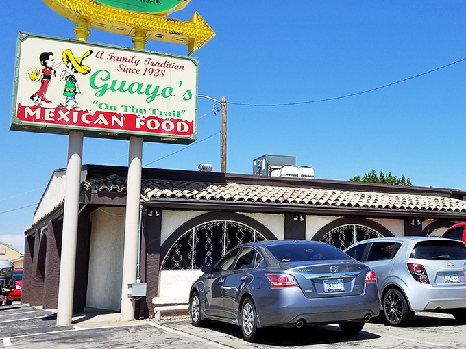 The iconic Guayo's sign stands proudly against the Arizona sky, a beacon of culinary tradition since 1938 that's guided hungry travelers for generations.