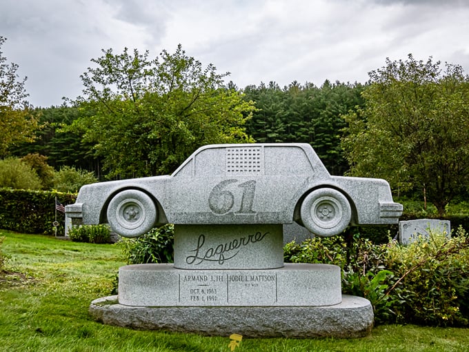 A granite race car serves as Armand Laquerre's eternal monument&mdash;proof that passion never dies, even when carved in stone.