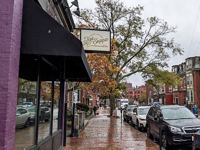 Rain-slicked streets lead to culinary treasure &ndash; Hot Suppa's purple exterior promises Southern warmth in Portland's West End.