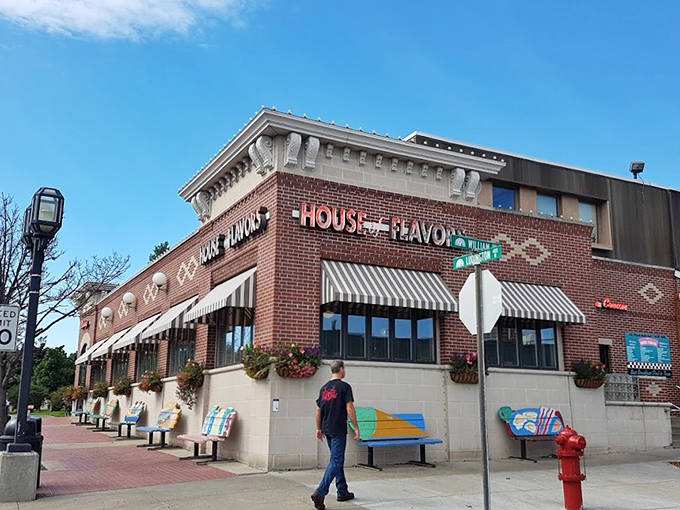 The iconic brick façade of House of Flavors stands proudly on Ludington's streets, promising sweet adventures within those striped-awning doorways.