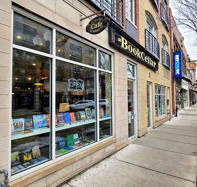 The welcoming façade of The BookCellar beckons bibliophiles with its golden signage and window displays that promise literary treasures within.