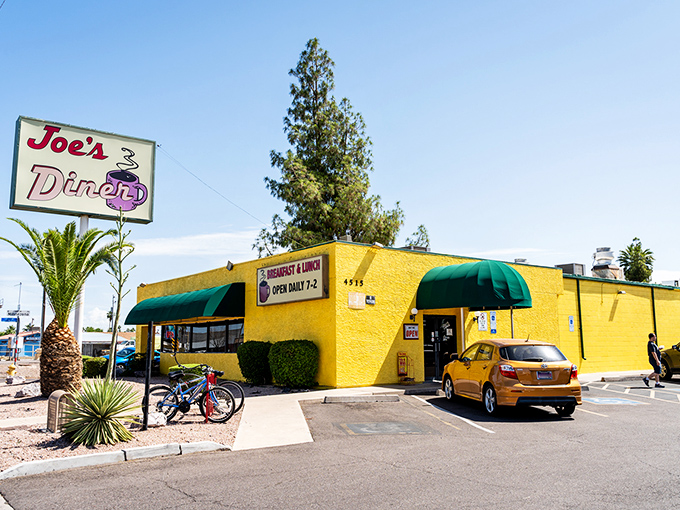 Joe's Diner: That sunshine-yellow exterior isn't just a building &ndash; it's a beacon of breakfast hope standing proudly against the Phoenix sky.