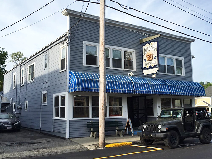 Jordan's Restaurant stands proudly on Cottage Street, its blue awnings and weathered sign promising breakfast treasures within this Bar Harbor institution.