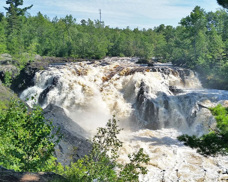 Kawishiwi Falls in full flow, where nature puts on a show that would make Broadway jealous.