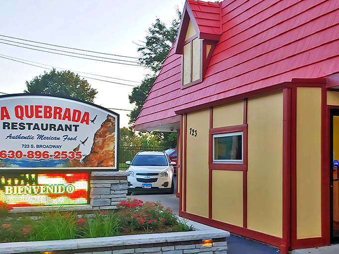 The distinctive red-roofed cottage of La Quebrada stands out on Broadway in Aurora, its humble exterior hiding culinary treasures within.