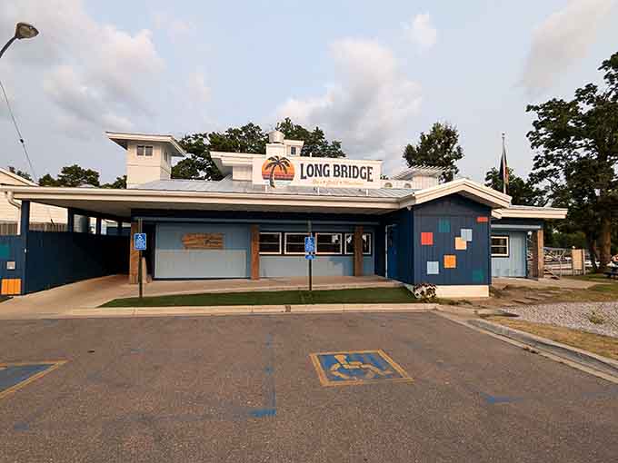 Long Bridge Bar's cheerful exterior welcomes visitors with colorful accents that promise good times and even better food inside.