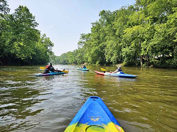 Your chariot awaits at Loveland Paddlesports, where the adventure begins with colorful kayaks ready to carry you downstream past medieval wonders.