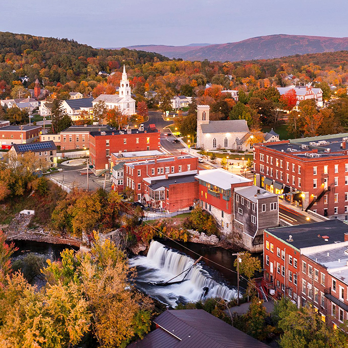 Middlebury: Autumn paints Middlebury in impossible colors, with the iconic falls and church steeples creating a scene that belongs on Vermont's tourism brochure cover.