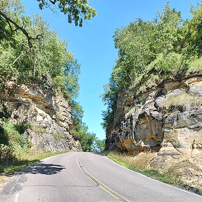 Nature's gateway: Towering rock walls frame the sky along Highway 108, where determination carved a path through solid stone.