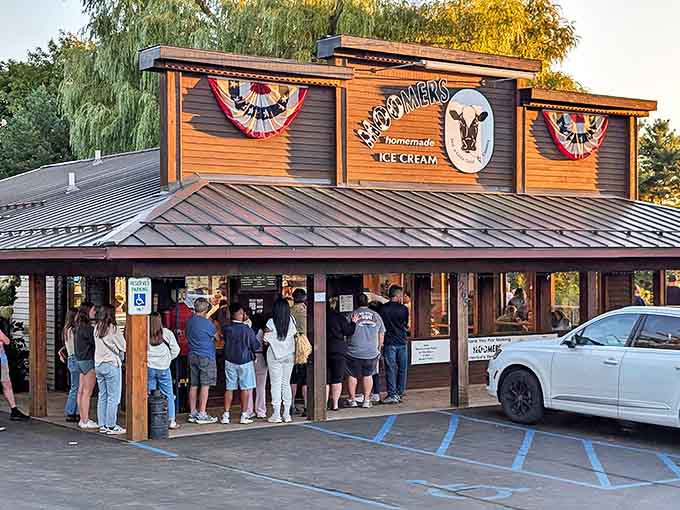 The rustic wooden exterior of Moomers draws crowds who willingly wait in line for what many consider Michigan's finest homemade ice cream.