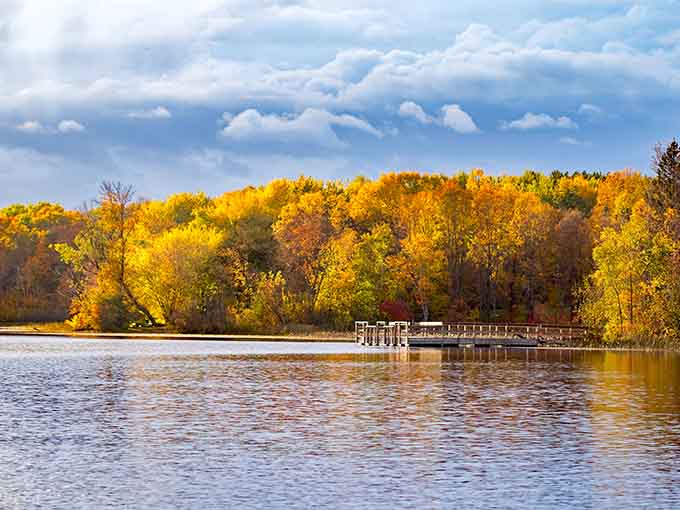 Echo Lake gleams like a jewel in autumn's crown, surrounded by trees showing off their finest gold and amber wardrobe.