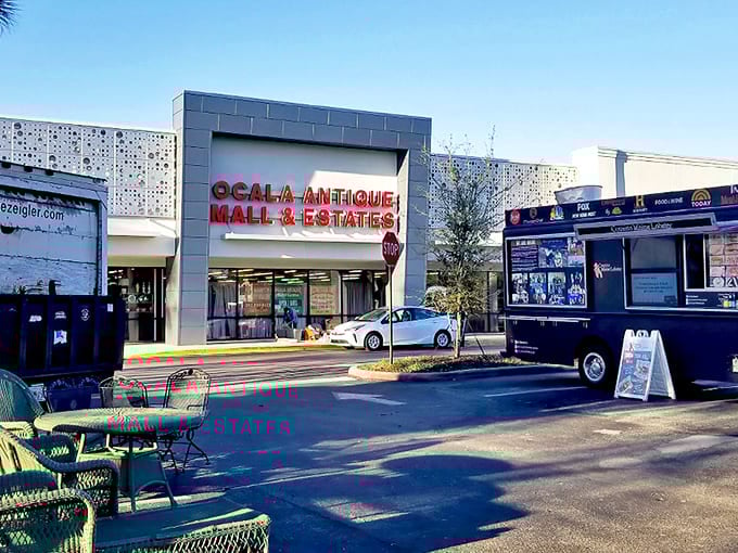 The welcoming facade of Ocala Antique Mall beckons treasure hunters with its bold red signage and promise of discoveries within.