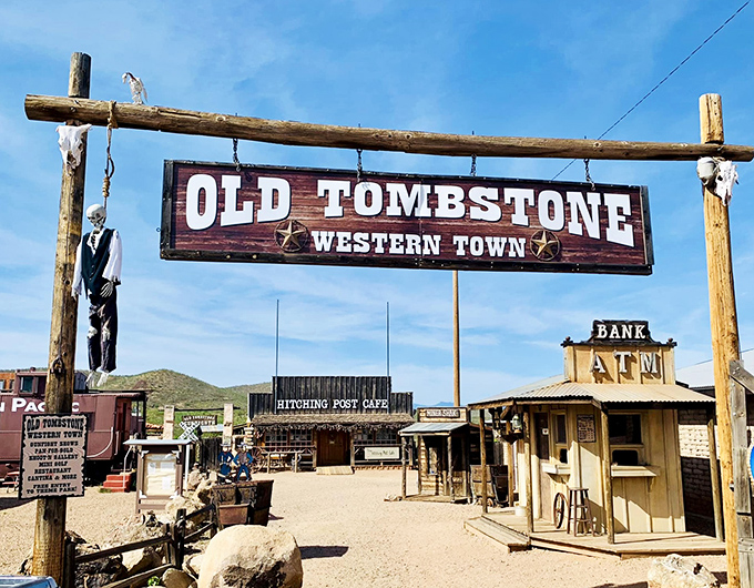 The grand entrance to Old Tombstone Western Theme Park welcomes visitors with rustic charm and a hanging noose &ndash; frontier hospitality at its finest!