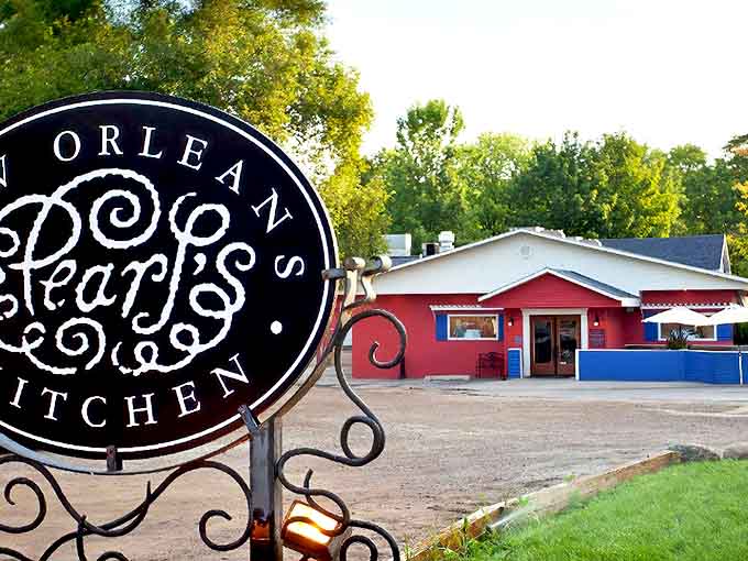 The vibrant red exterior with blue accents announces you've found a slice of New Orleans hiding in Northern Michigan's charming landscape.