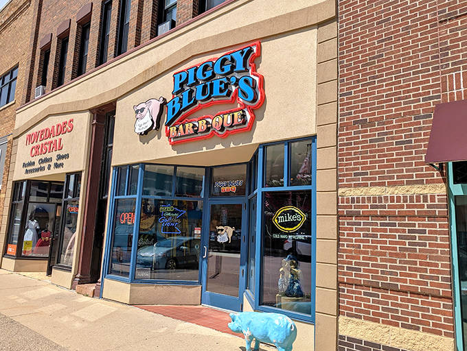 The bright blue storefront with its sunglasses-wearing pig mascot promises smoky delights within &ndash; a beacon for BBQ lovers in Austin.