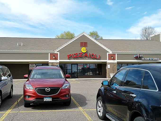 That cheerful yellow swirl logo beckons like a beacon of hope for hungry travelers navigating suburban Minnesota's pizza landscape.