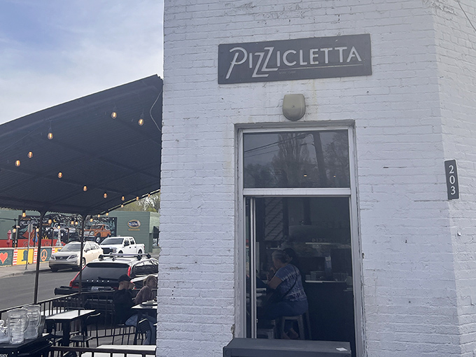 The unassuming white brick exterior of Pizzicletta belies the culinary treasures within &ndash; a true hidden gem in downtown Flagstaff.