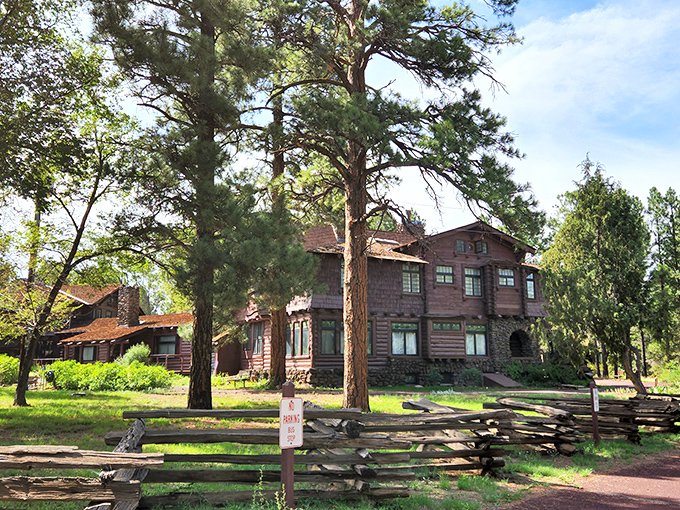 The Riordan Mansion stands proudly among towering ponderosas, its rustic elegance a testament to early 20th-century craftsmanship and vision.