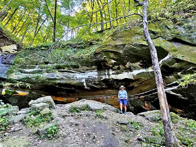 Nature's grand architecture on display: towering rock formations create a dramatic backdrop for adventurers on the Sand Cave Trail.