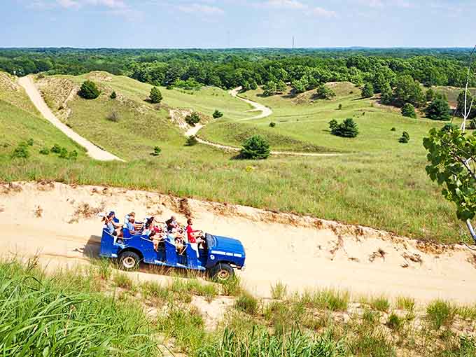 That bright blue chariot conquering the dunes looks like someone crossed a pickup truck with a theme park ride, and honestly, that's exactly what makes it perfect for this sandy adventure.