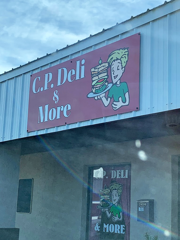 Welcome to sandwich paradise! CP Deli's sign promises "& More," and boy, do they deliver. Get ready for a flavor adventure.