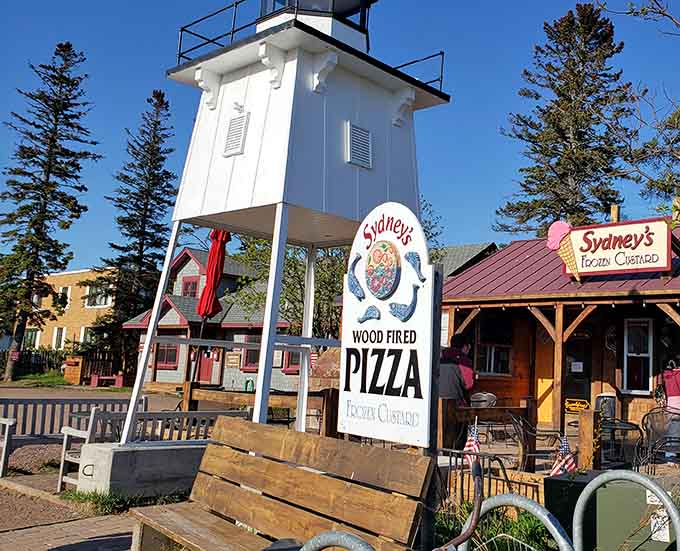 That lighthouse tower topped with a giant ice cream cone isn't just adorable, it's a beacon calling all custard lovers home.