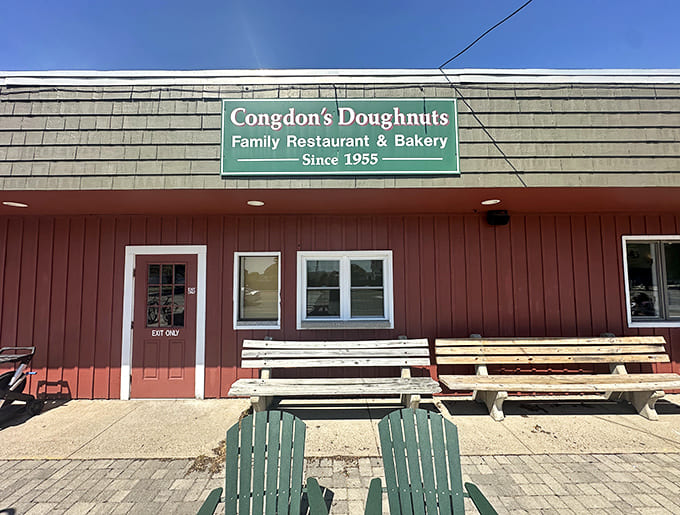 That red exterior and green sign have been beckoning doughnut lovers since the 1950s, promising fried perfection within.