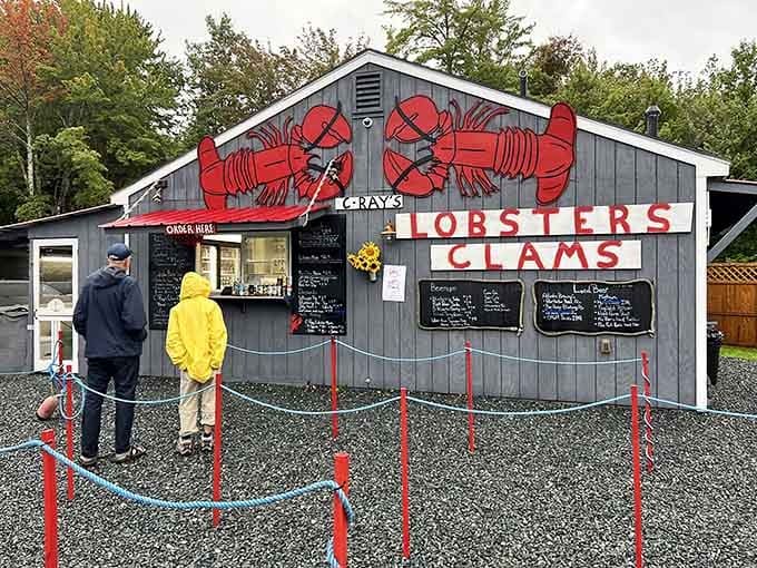Those giant red lobsters aren't just decoration; they're a promise of the crustacean delights waiting inside this charming roadside gem.