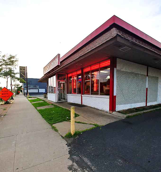 That glowing red trim isn't just decoration; it's a delicious warning that something special awaits inside this Kansas City landmark.