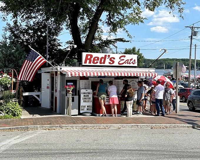 The iconic Red's Eats stands proudly along Route 1, its red and white awning beckoning seafood lovers like a lighthouse for hungry travelers.